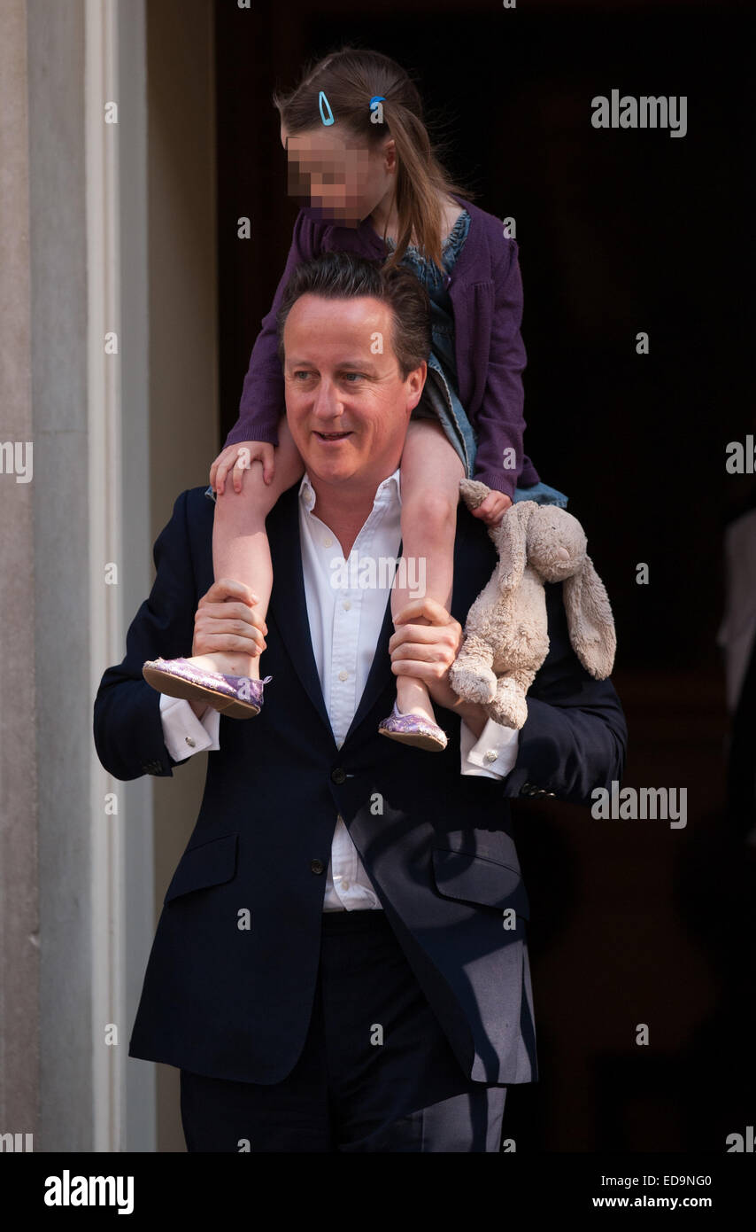 David Cameron leaves Downing Street carrying his daughter Florence ...