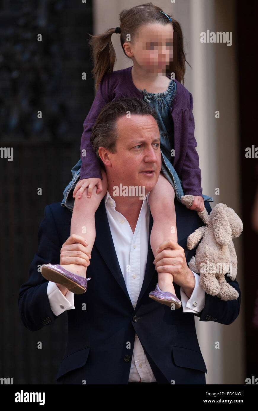 David Cameron leaves Downing Street carrying his daughter Florence ...