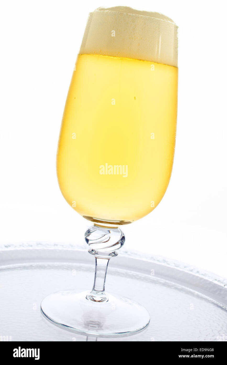 Refreshing yellow beer in the backlight Stock Photo - Alamy