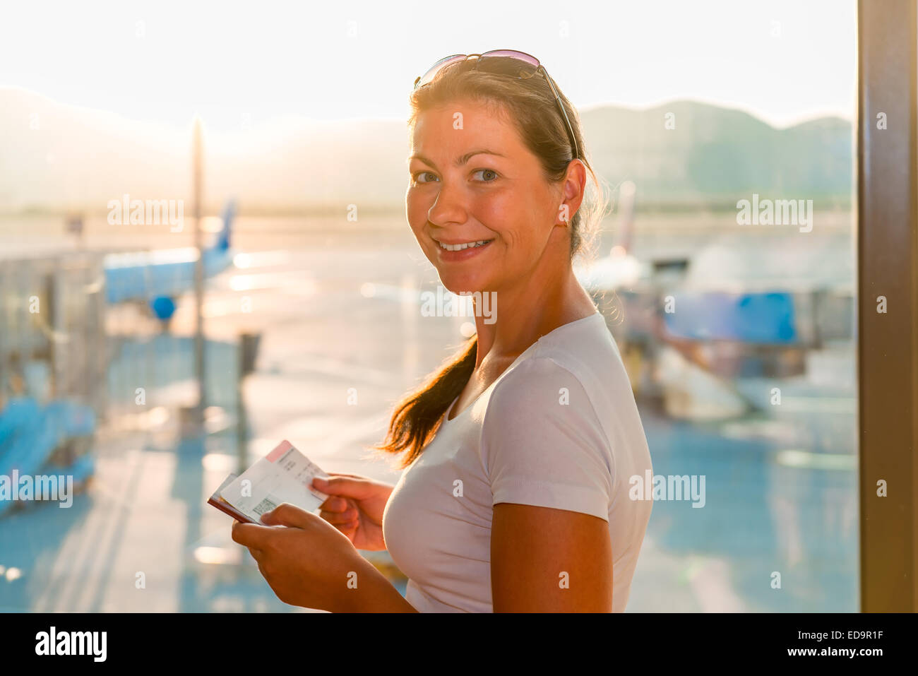 girl with a beautiful smile is waiting for boarding Stock Photo - Alamy