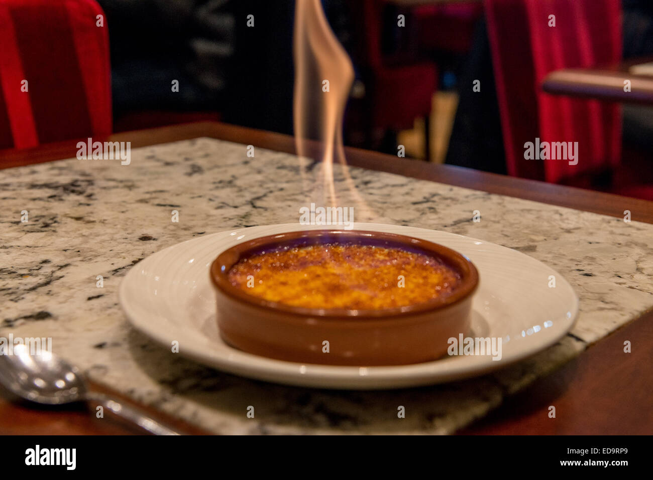 French crème brûlée on fire Stock Photo - Alamy