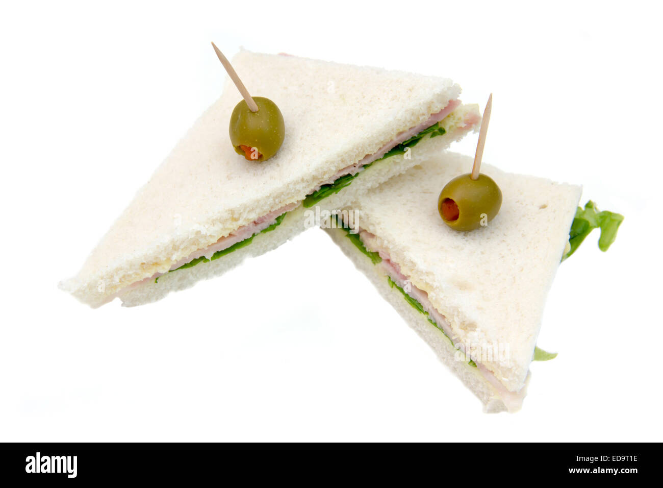 Triangular sandwiches on white background seen up close Stock Photo - Alamy