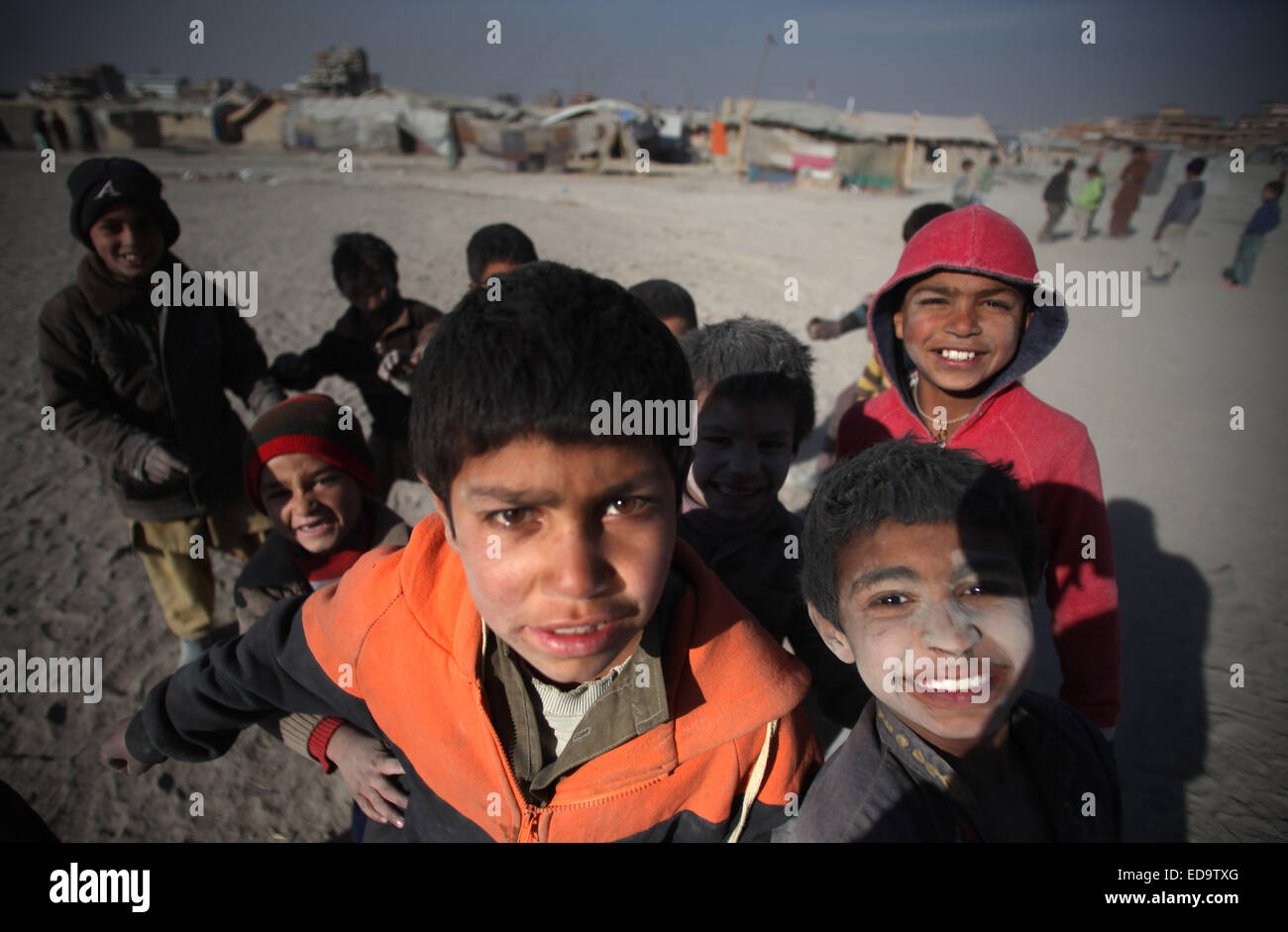 Kabul, Afghanistan. 3rd Jan, 2015. Afghan children play on the dusty ...