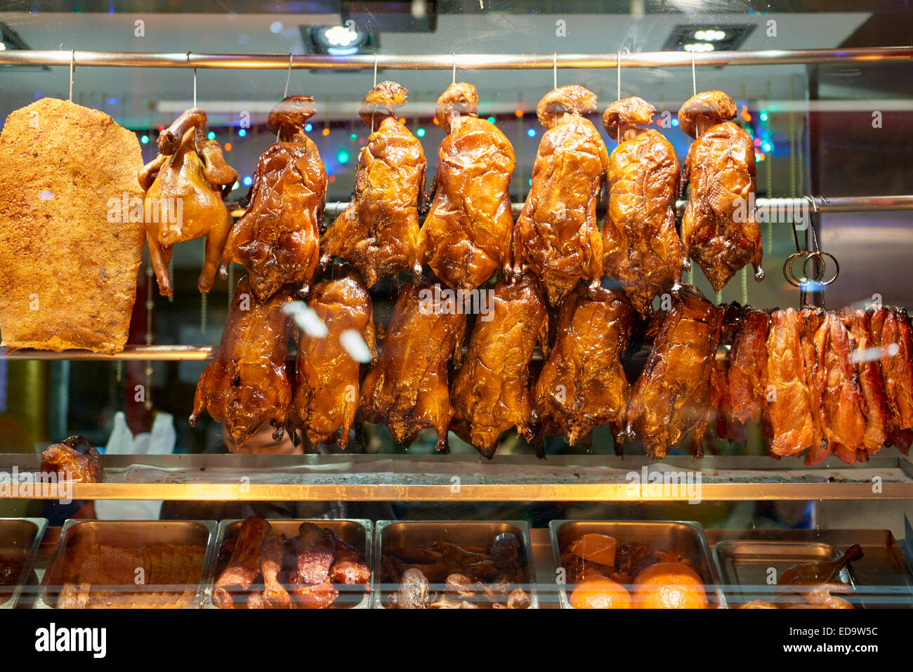 Detail of Chinese restaurant with traditional crispy ducks hanging on ...