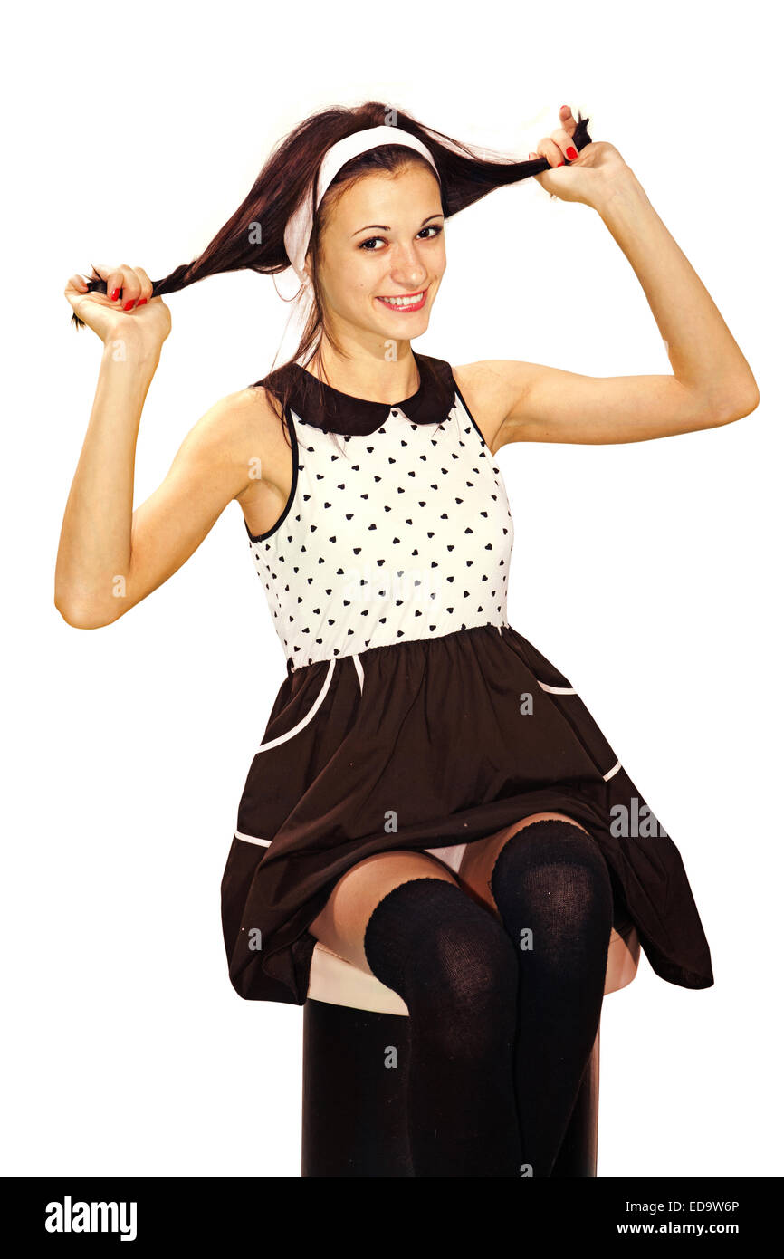 playful mad woman plays with her hair on white background Stock Photo ...