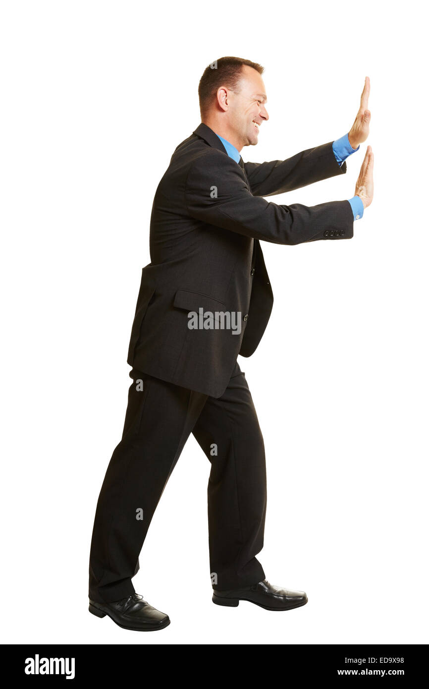 Isolated full body business man pushing imaginary wall Stock Photo - Alamy