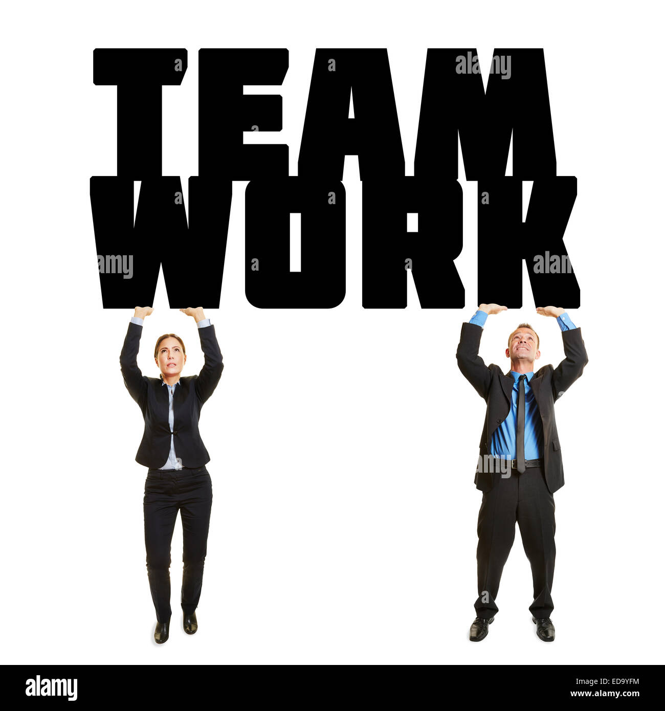 Two business people lifting together the word Teamwork Stock Photo - Alamy
