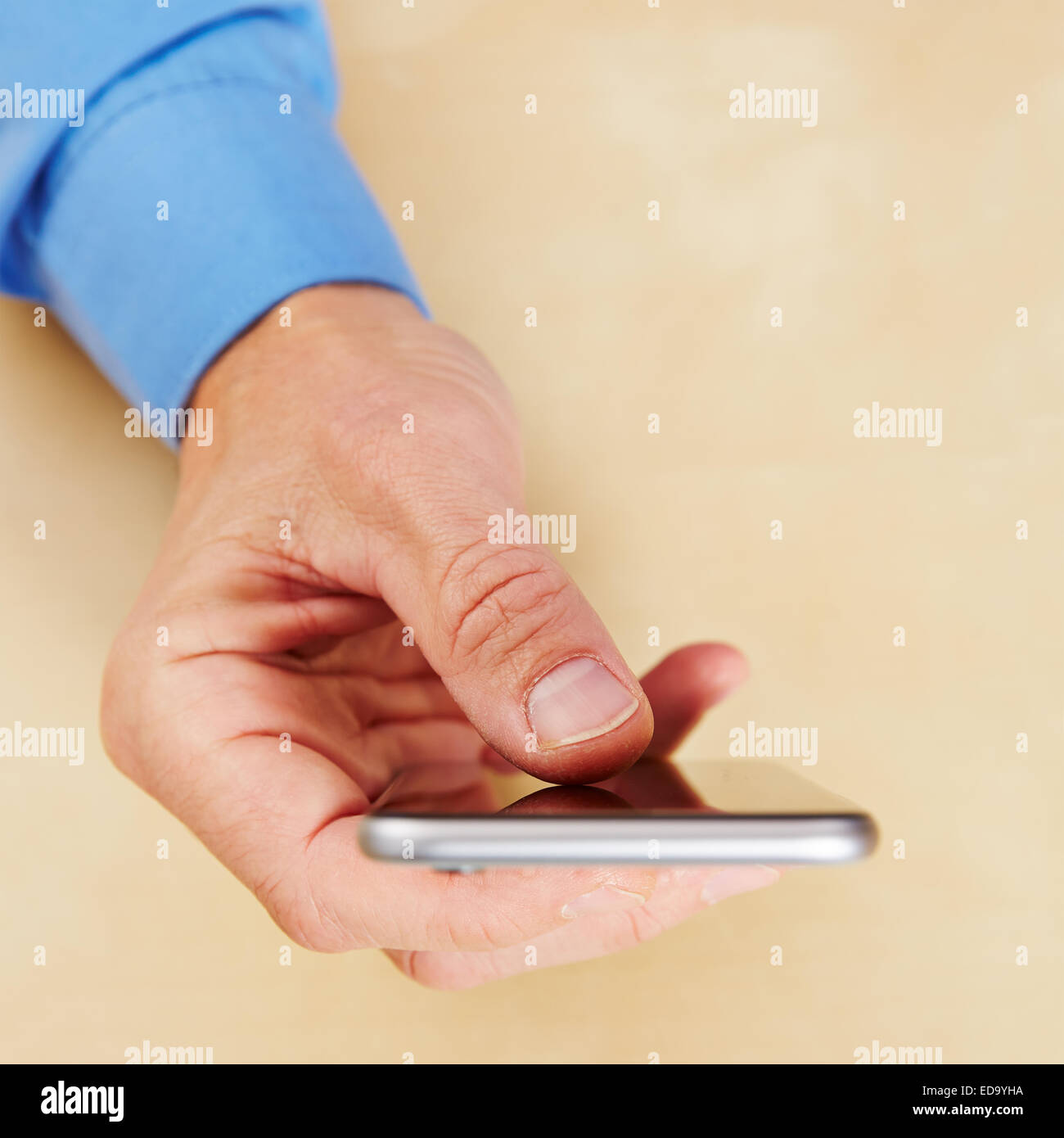 Hand with thumb on a smartphone from above Stock Photo - Alamy