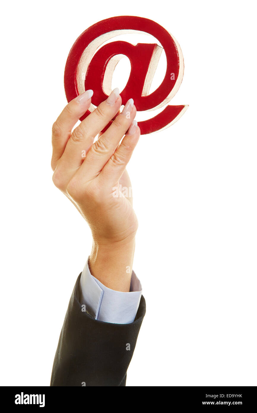 Hand holding a big red at sign as email symbol Stock Photo - Alamy