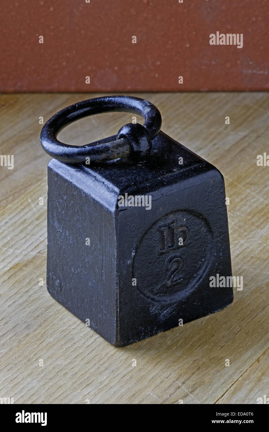 Close up of an antique 2 pound weight. Measurement concept Stock Photo ...