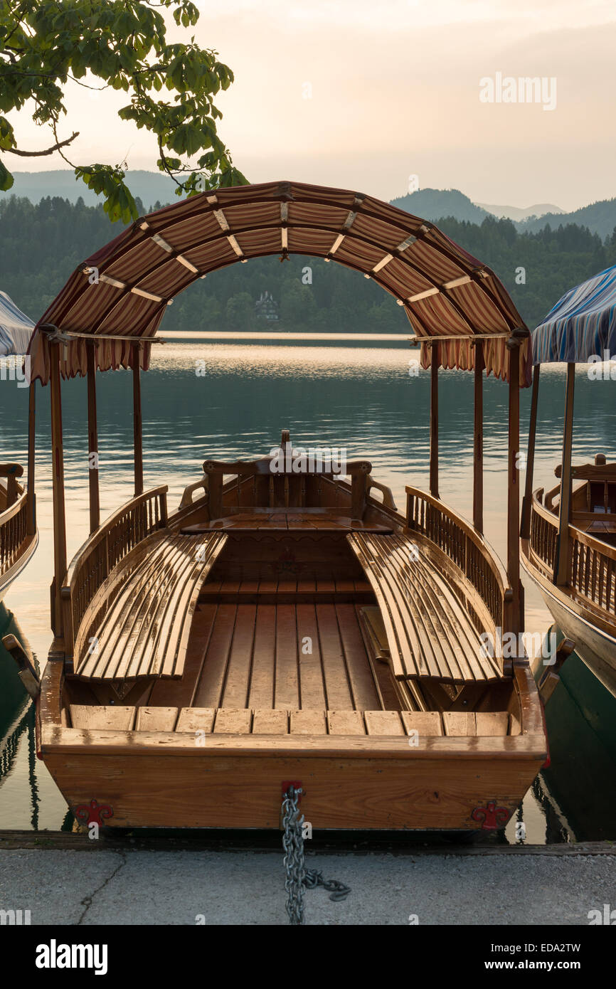 Touring boat on famous Lake Bled, Slovenia at sunset Stock Photo - Alamy