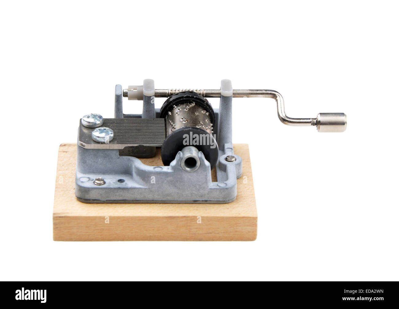 mechanism barrel organ on wooden plate isolated over white Stock Photo ...