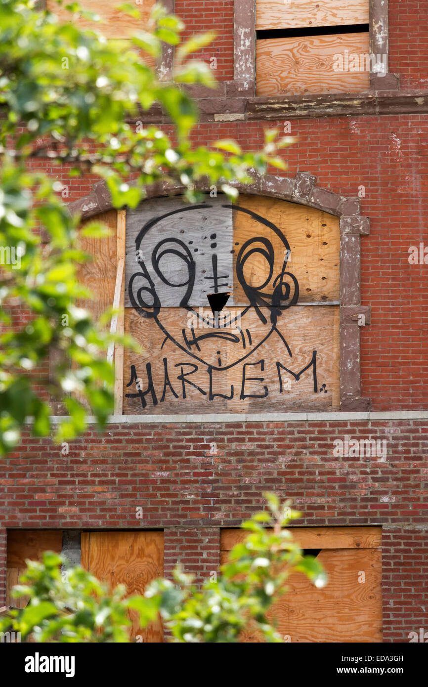 Graffiti on boarded up window in Harlem New York city Stock Photo - Alamy