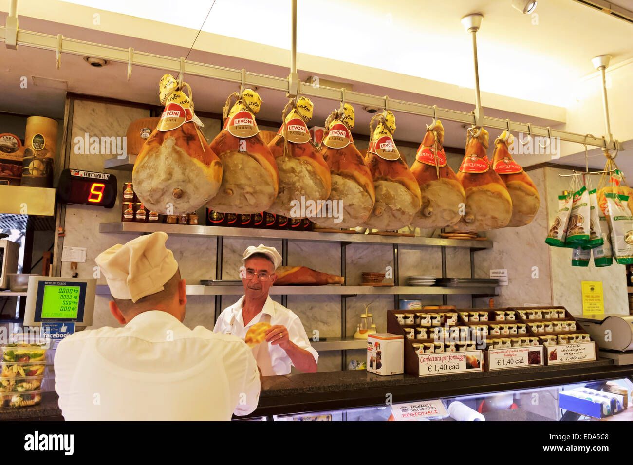 Hamon hanging in a delicatessen in Rome, Italy Stock Photo - Alamy