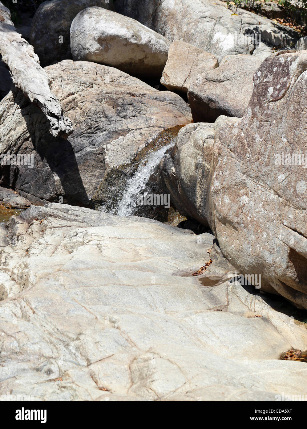 Waterfall between big beautiful stones photographed closeup Stock Photo ...