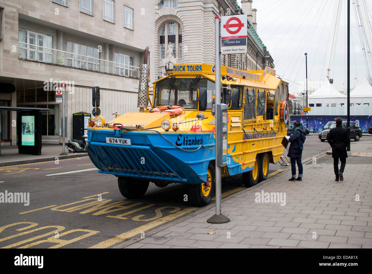 London Duck Tours yellow amphibious vehicle Elizabeth at the London Eye ...
