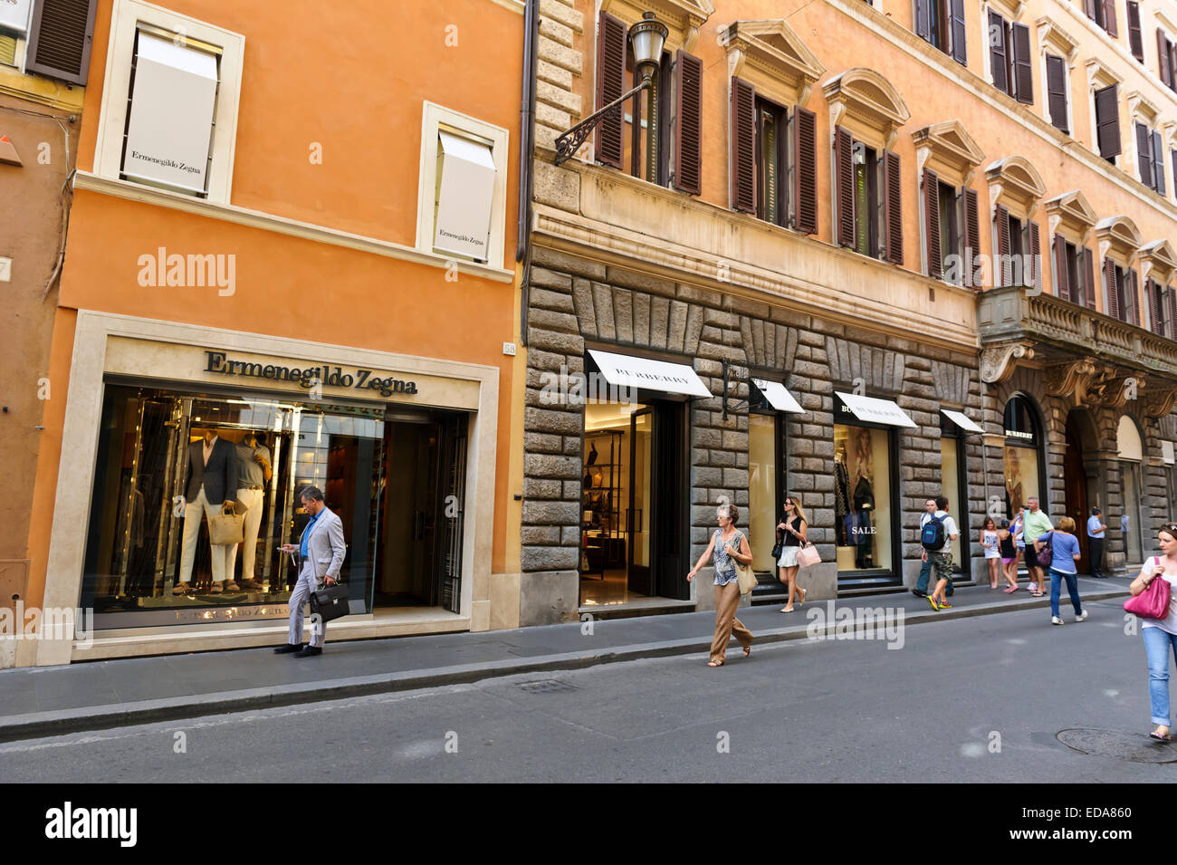 Tourists exploring the famous Via Condotti street with designer and ...