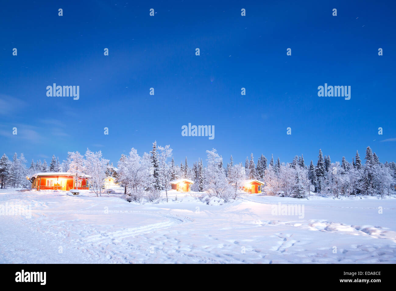 Winter landscape with cabin hut at night in Kiruna Sweden at Night with ...