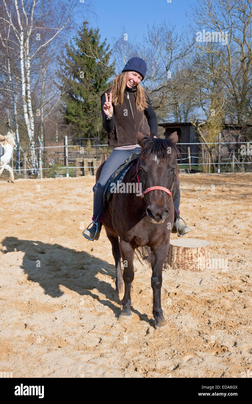 Woman riding pony hi-res stock photography and images - Alamy