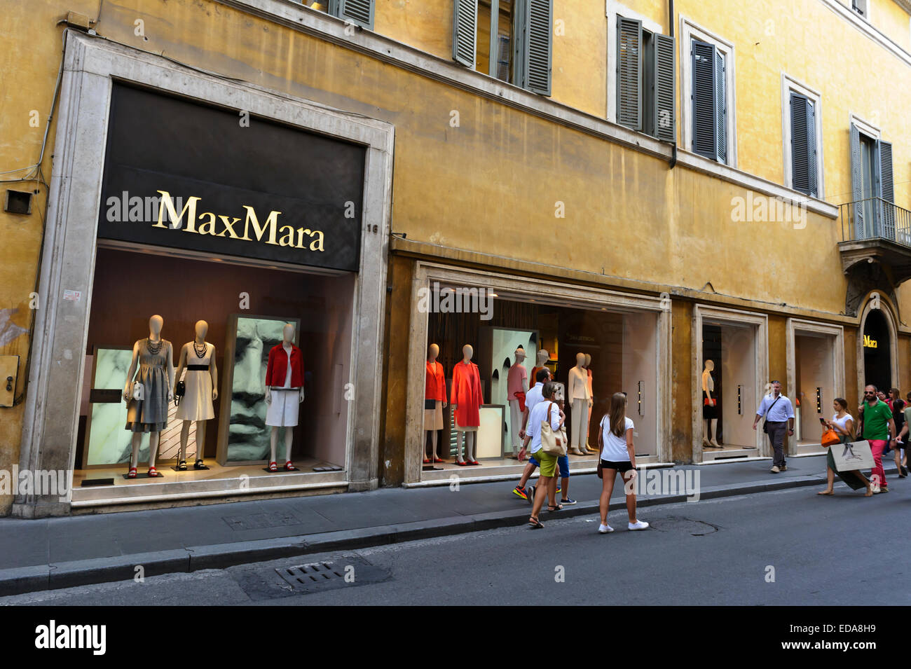 Tourists exploring the famous Via Condotti street with designer and ...
