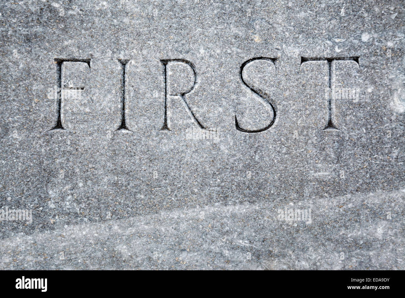 Closeup of word First from inscription on a statue in Washington DC ...