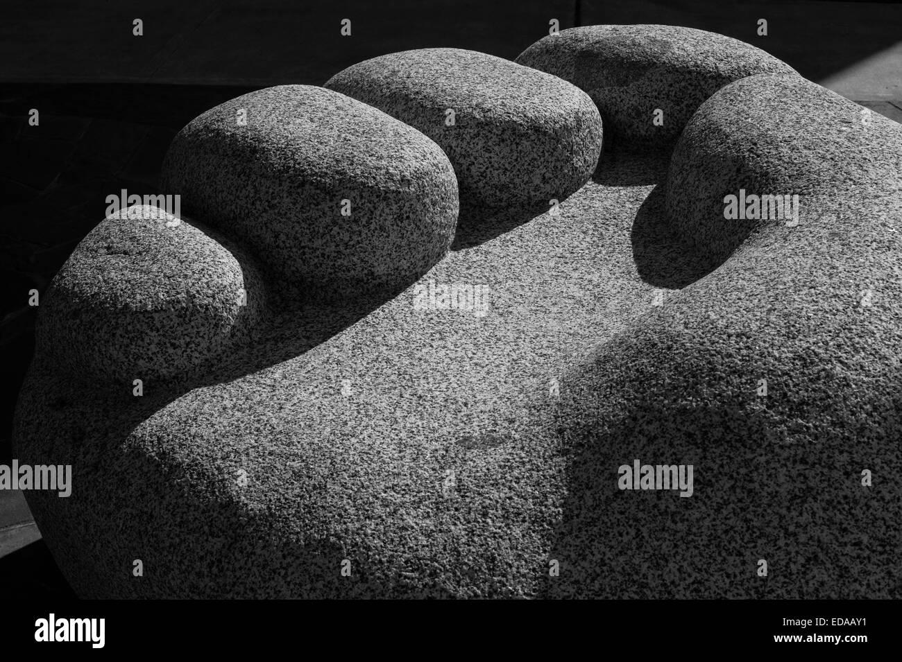 Visual art hand carved into stone making a fist Stock Photo - Alamy