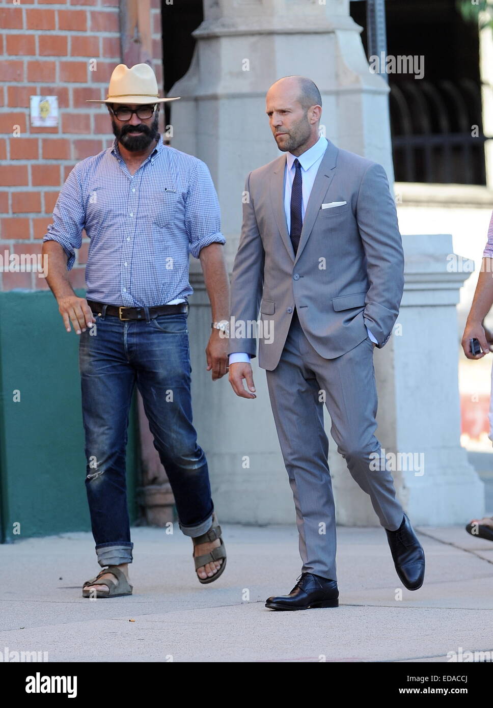 Actor Jason Statham puts on a gray suit at a photoshoot in downtown L.A ...