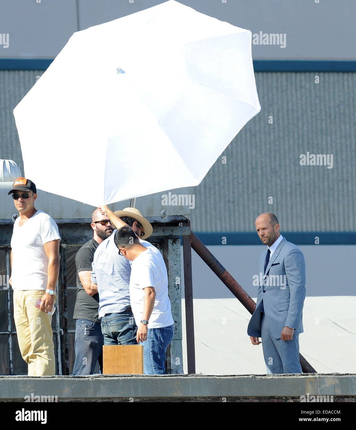 Actor Jason Statham puts on a gray suit at a photoshoot in downtown L.A ...