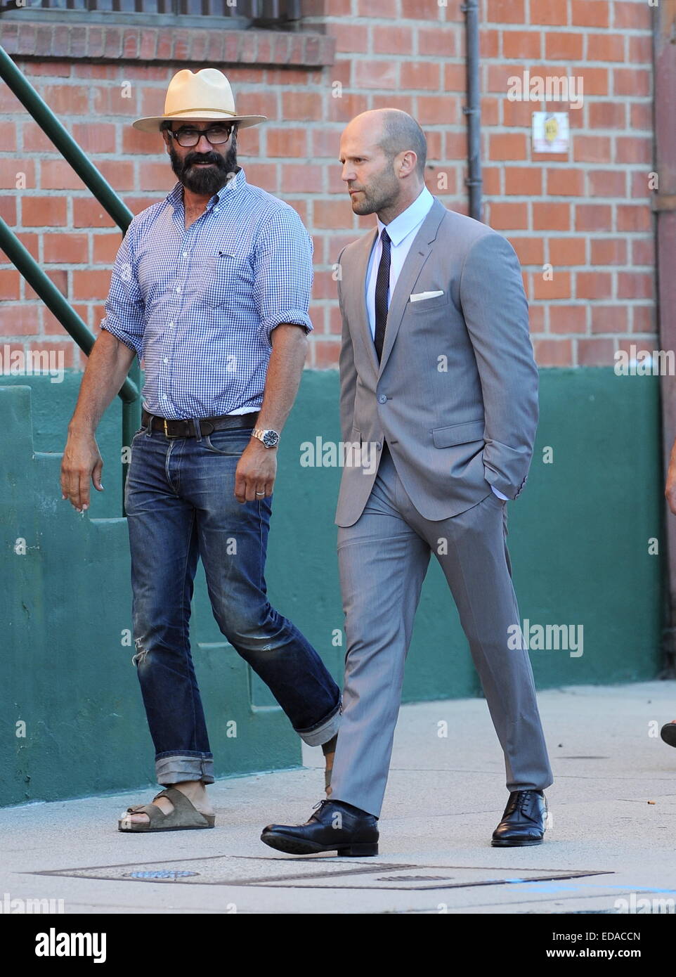 Actor Jason Statham puts on a gray suit at a photoshoot in downtown L.A ...