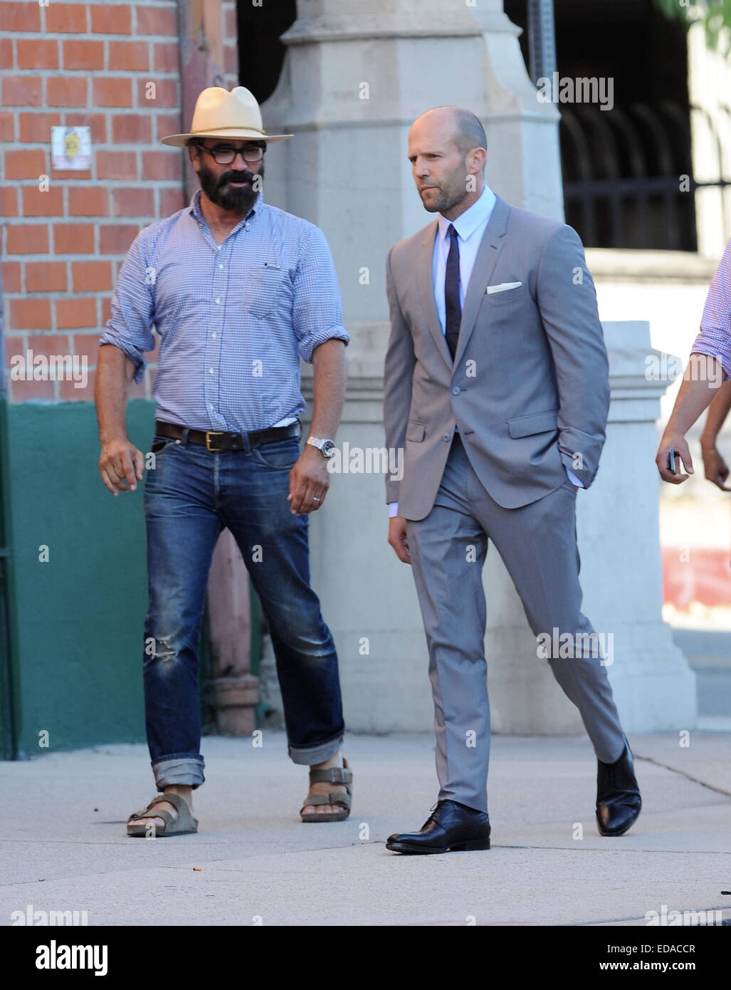 Actor Jason Statham puts on a gray suit at a photoshoot in downtown L.A ...