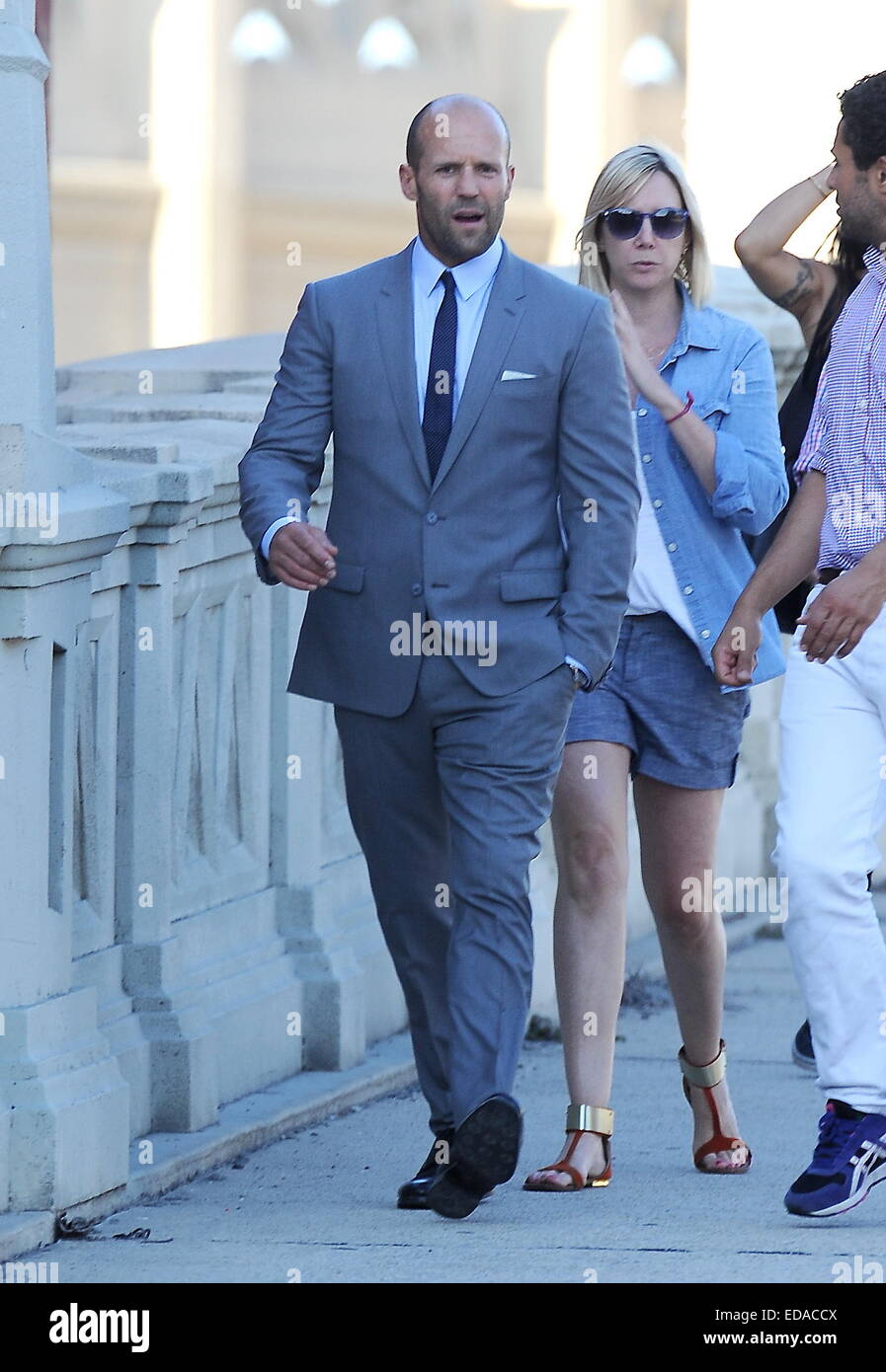 Actor Jason Statham puts on a gray suit at a photoshoot in downtown L.A ...