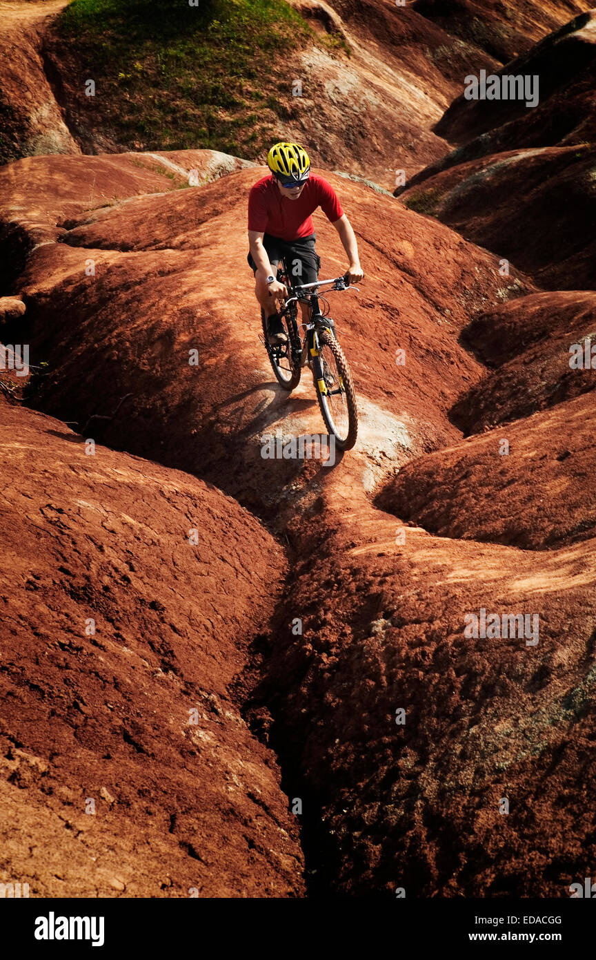 Man biking in the badlands Stock Photo - Alamy