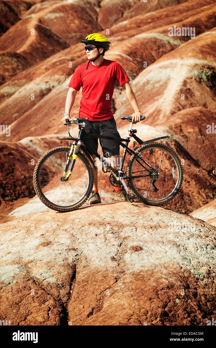 Man biking in the badlands Stock Photo - Alamy