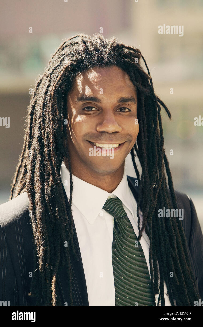 Businessman with dreadlocks Stock Photo - Alamy