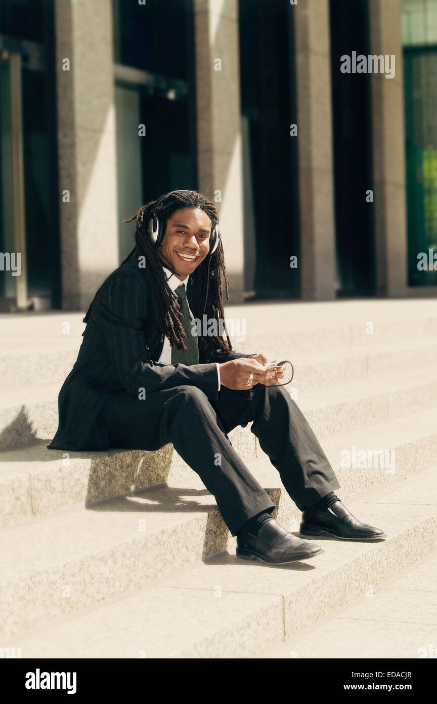 Businessman with dreadlocks Stock Photo - Alamy