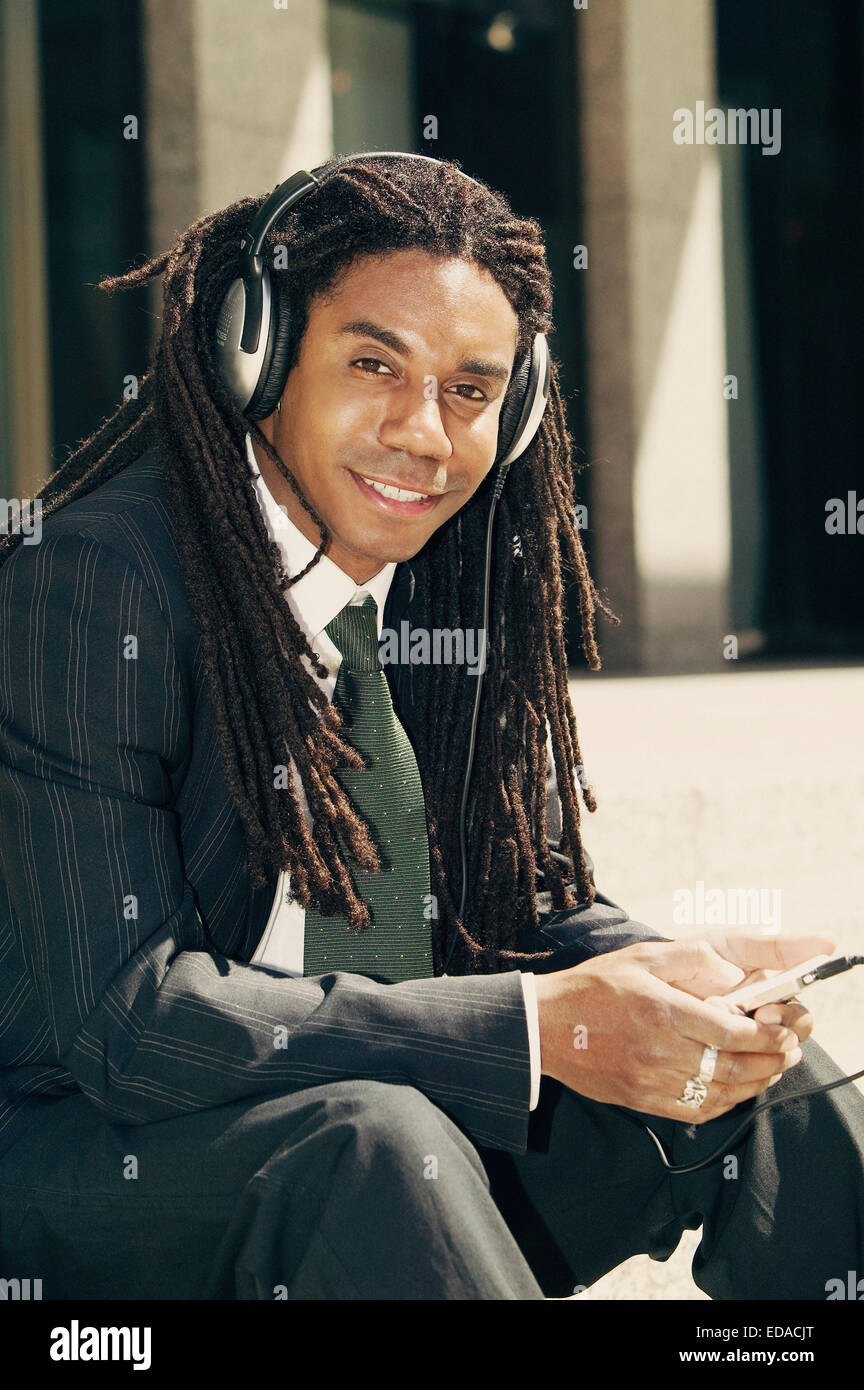 Businessman with dreadlocks Stock Photo - Alamy