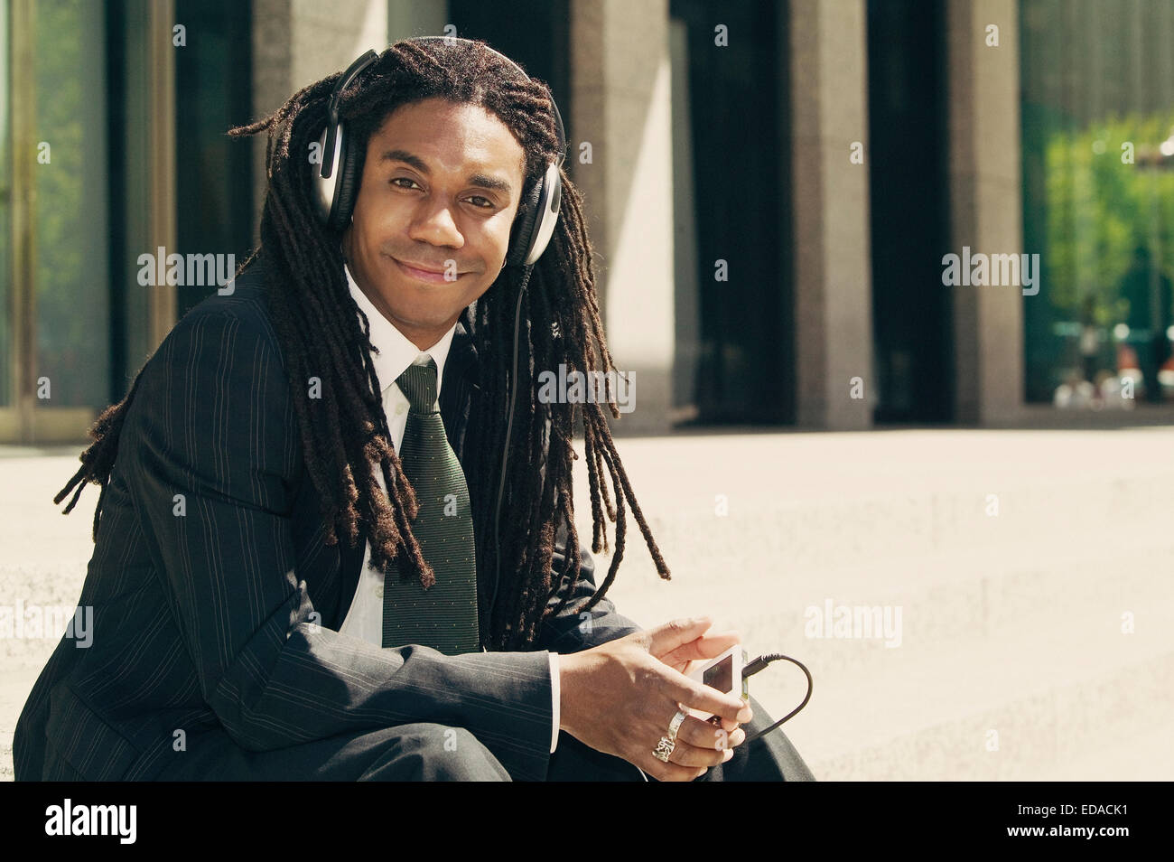 Businessman with dreadlocks Stock Photo - Alamy