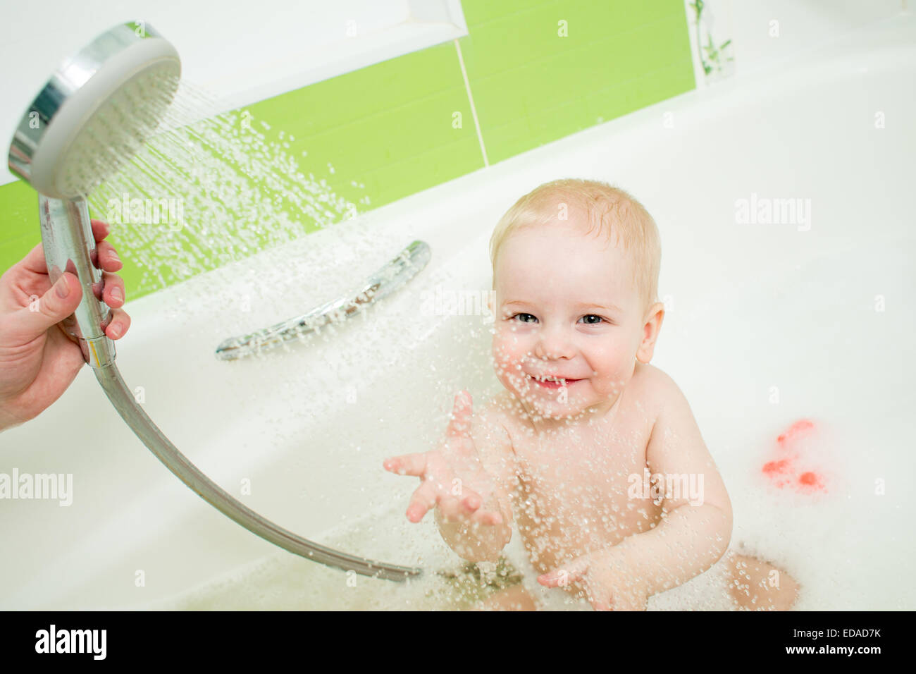 Cute baby taking a bath Stock Photo - Alamy