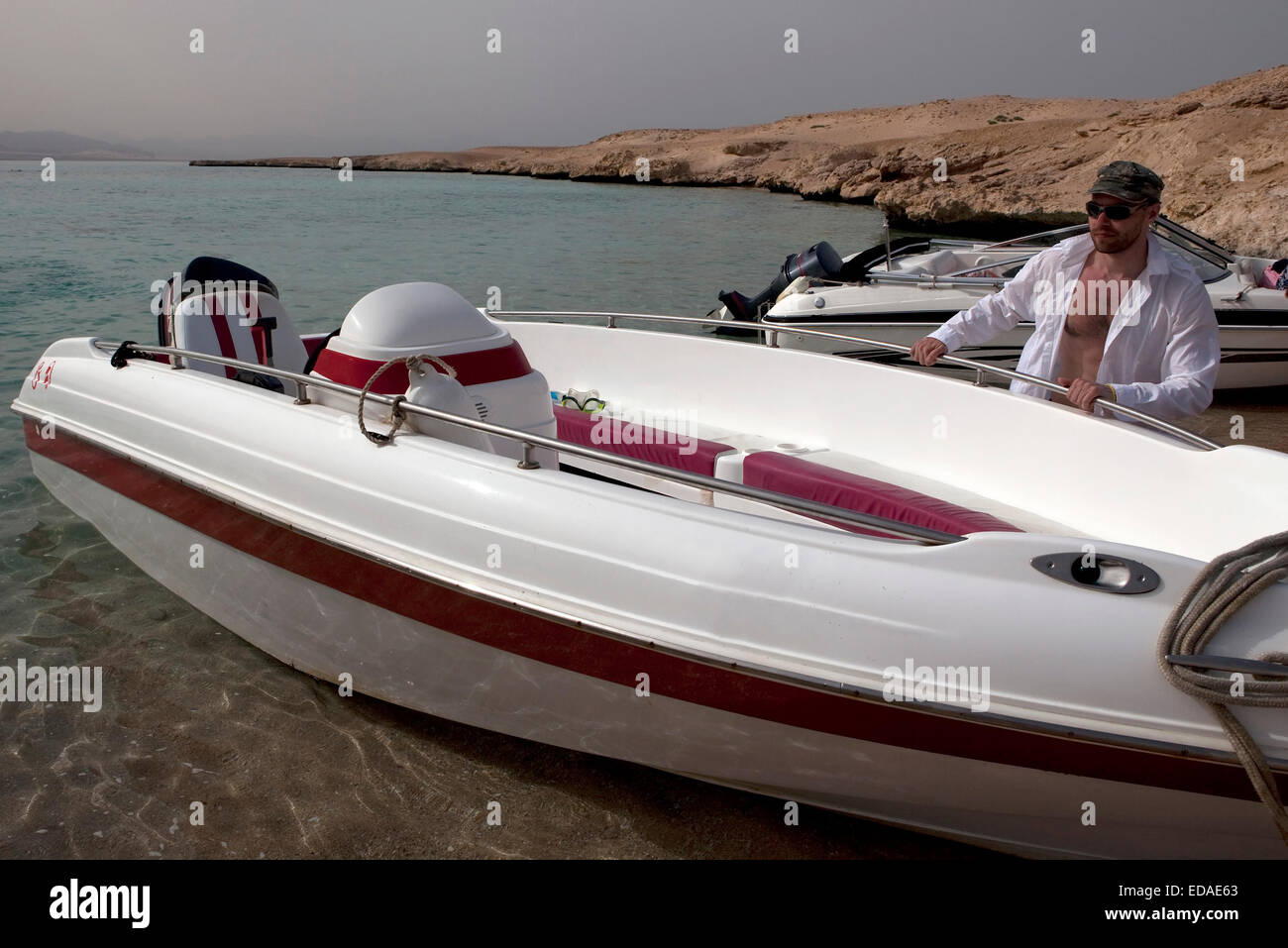 Captain and boat Stock Photo - Alamy