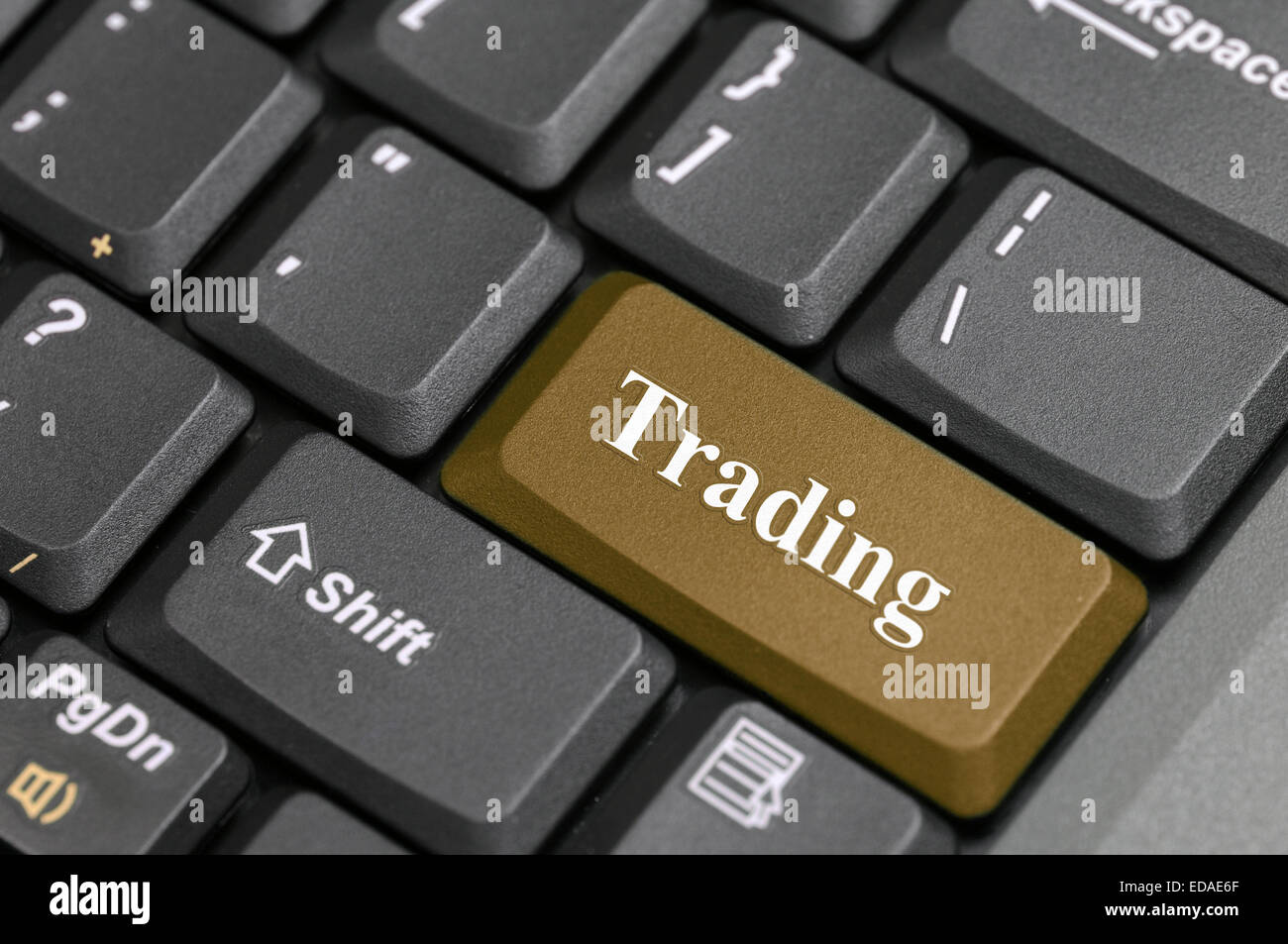 Brown trading key on keyboard Stock Photo - Alamy