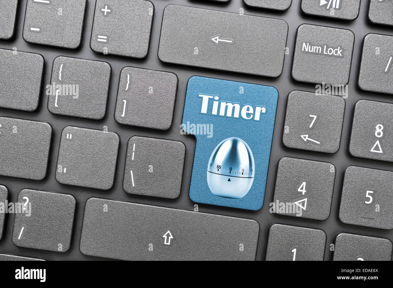 Blue timer key on keyboard Stock Photo - Alamy