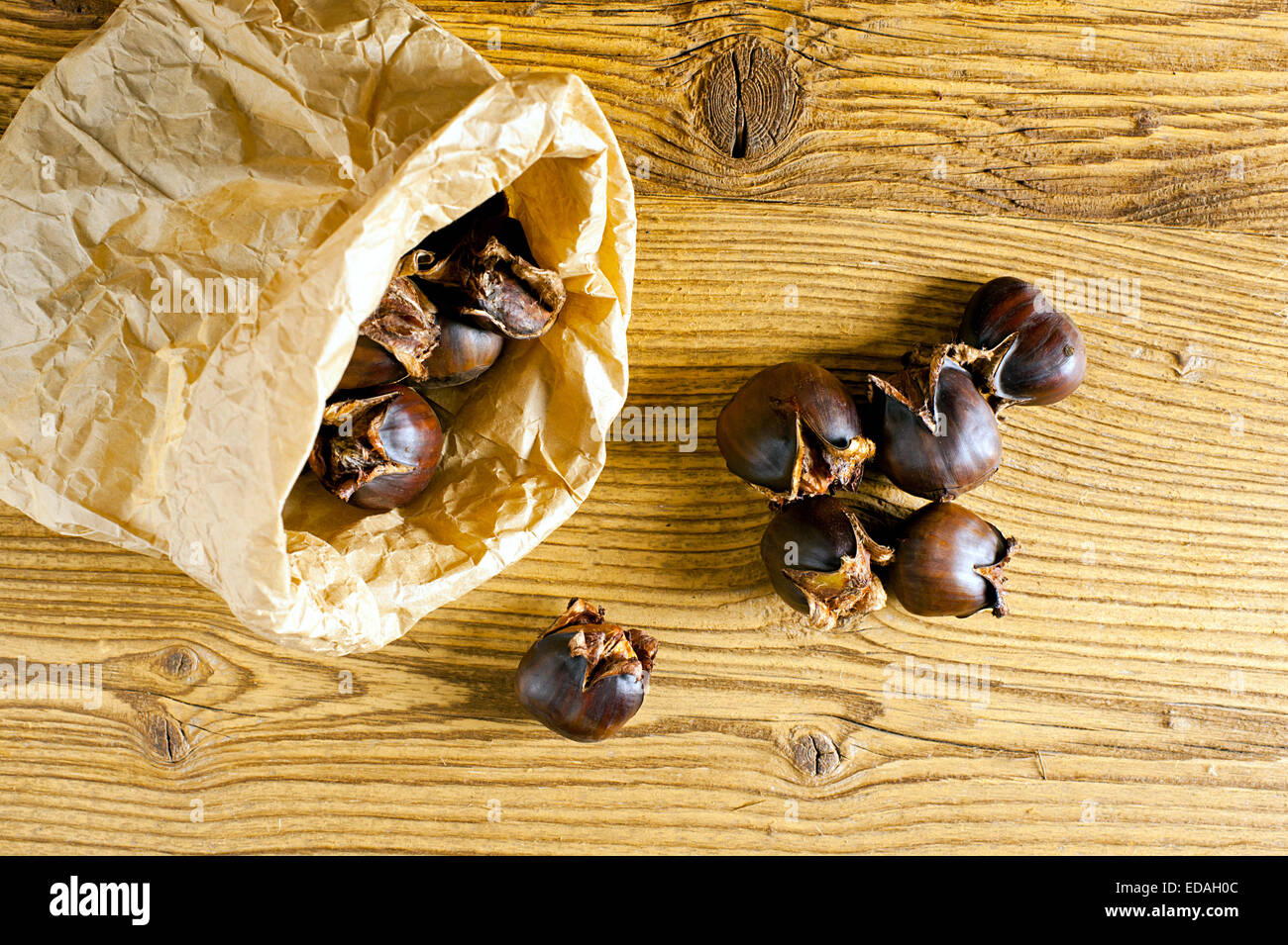 baked sweet chestnuts in paper bag Stock Photo - Alamy