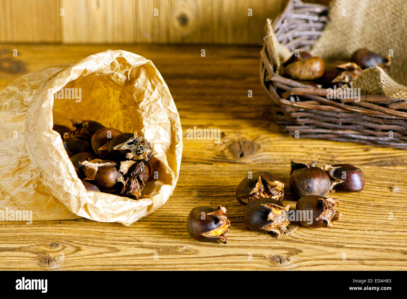 baked sweet chestnuts in paper bag Stock Photo - Alamy
