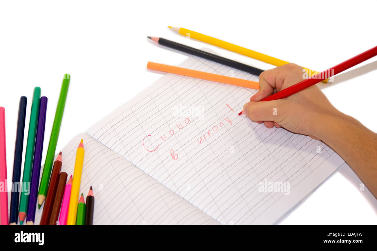 Pencils and writing on a white background isolated Stock Photo - Alamy