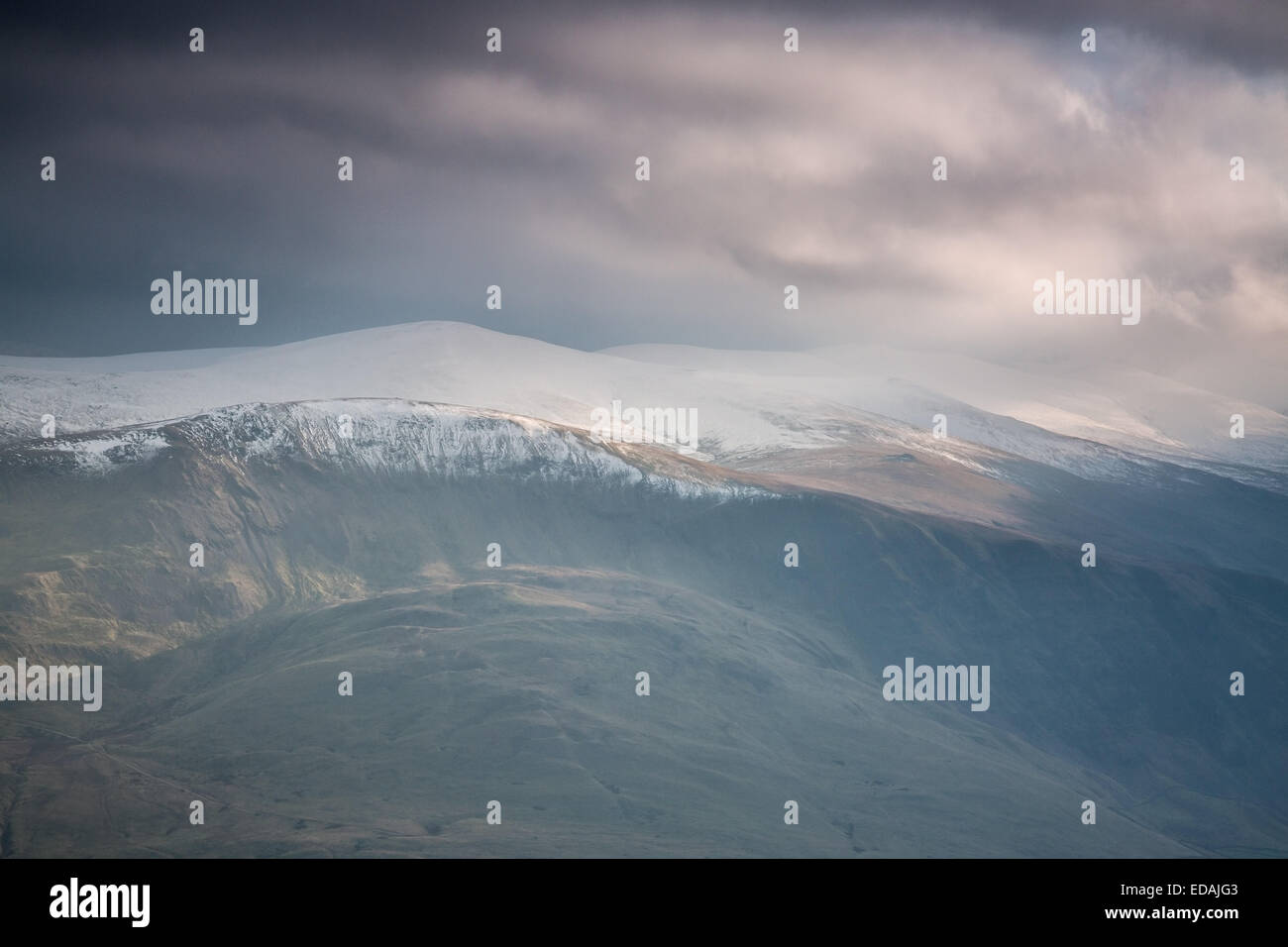 Snow capped Threlkeld with sunlight beam from Blencathra Keswick Lake ...