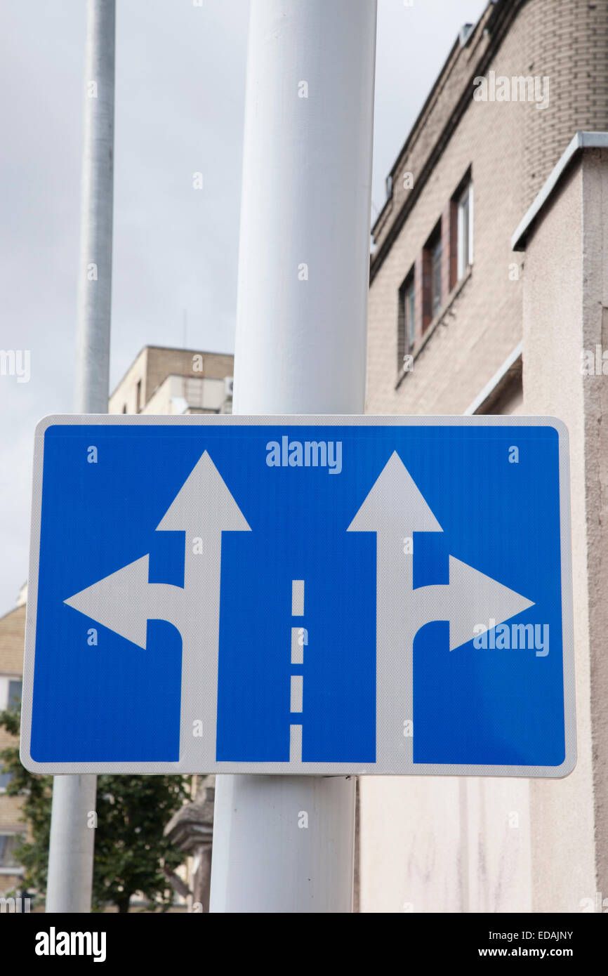 Blue and White Double Arrow Traffic Sign Stock Photo - Alamy