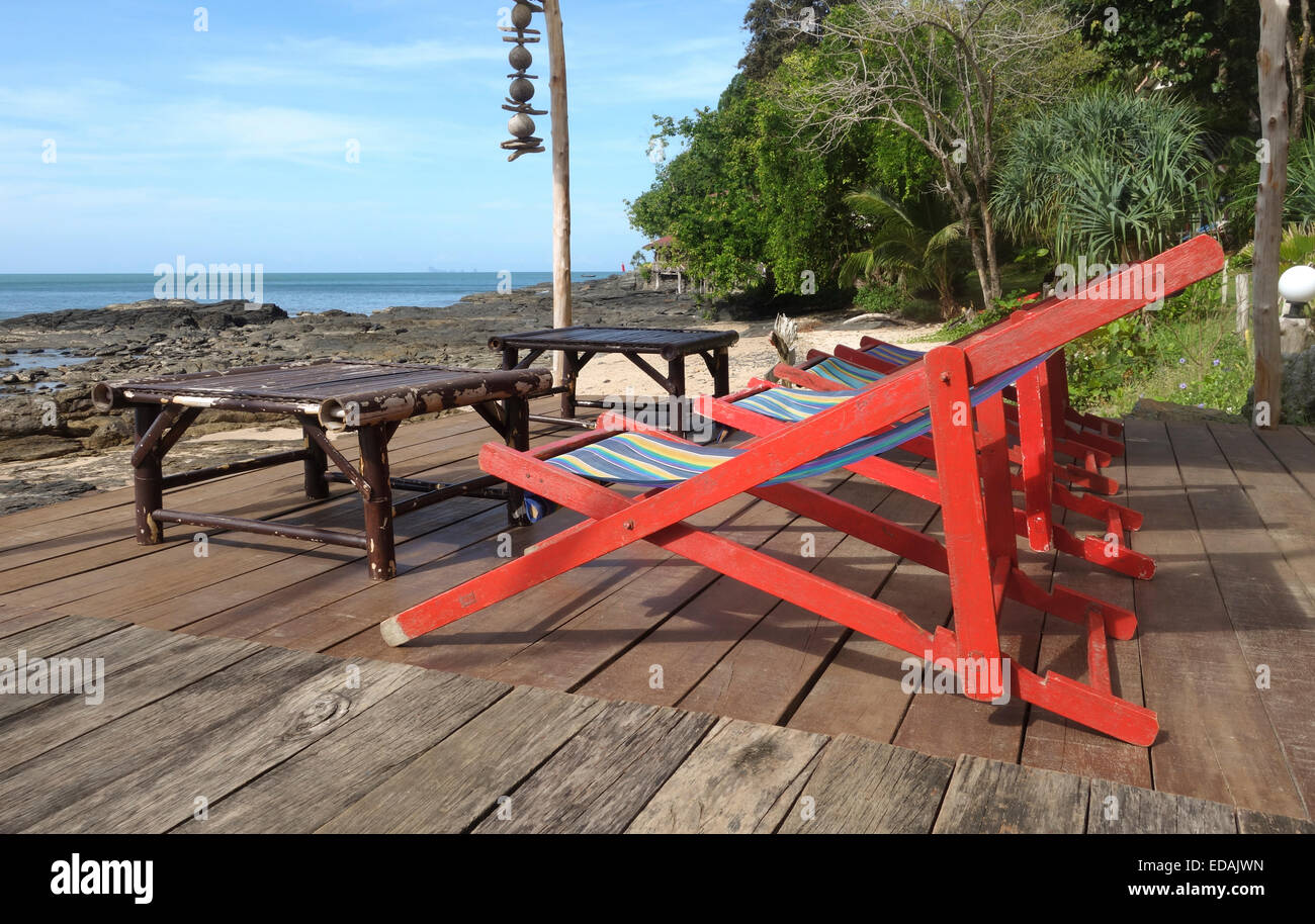 Wooden beach chair on deck of resort, bamboo bay, Koh Lanta Thailand ...