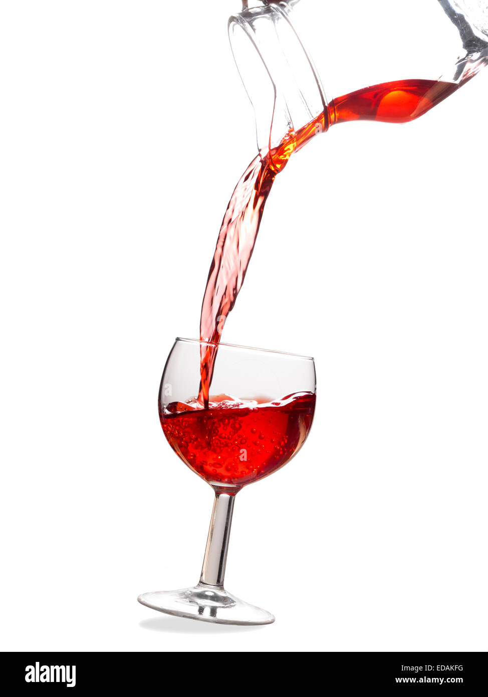 Red fruit cordial pours from jug Stock Photo - Alamy