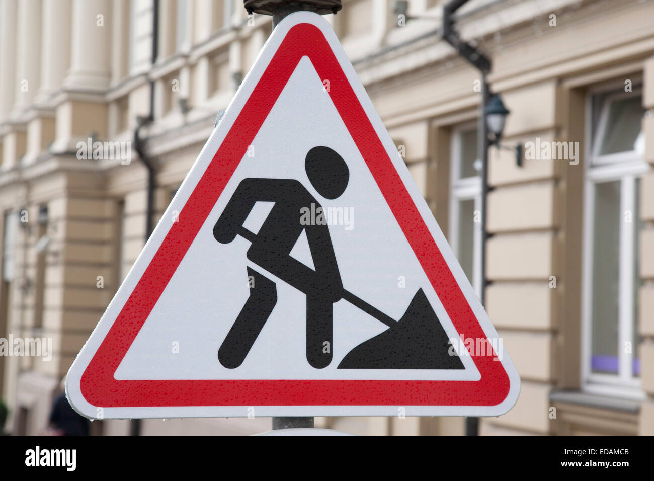 Men at Work Traffic Sign in Urban Setting Stock Photo - Alamy
