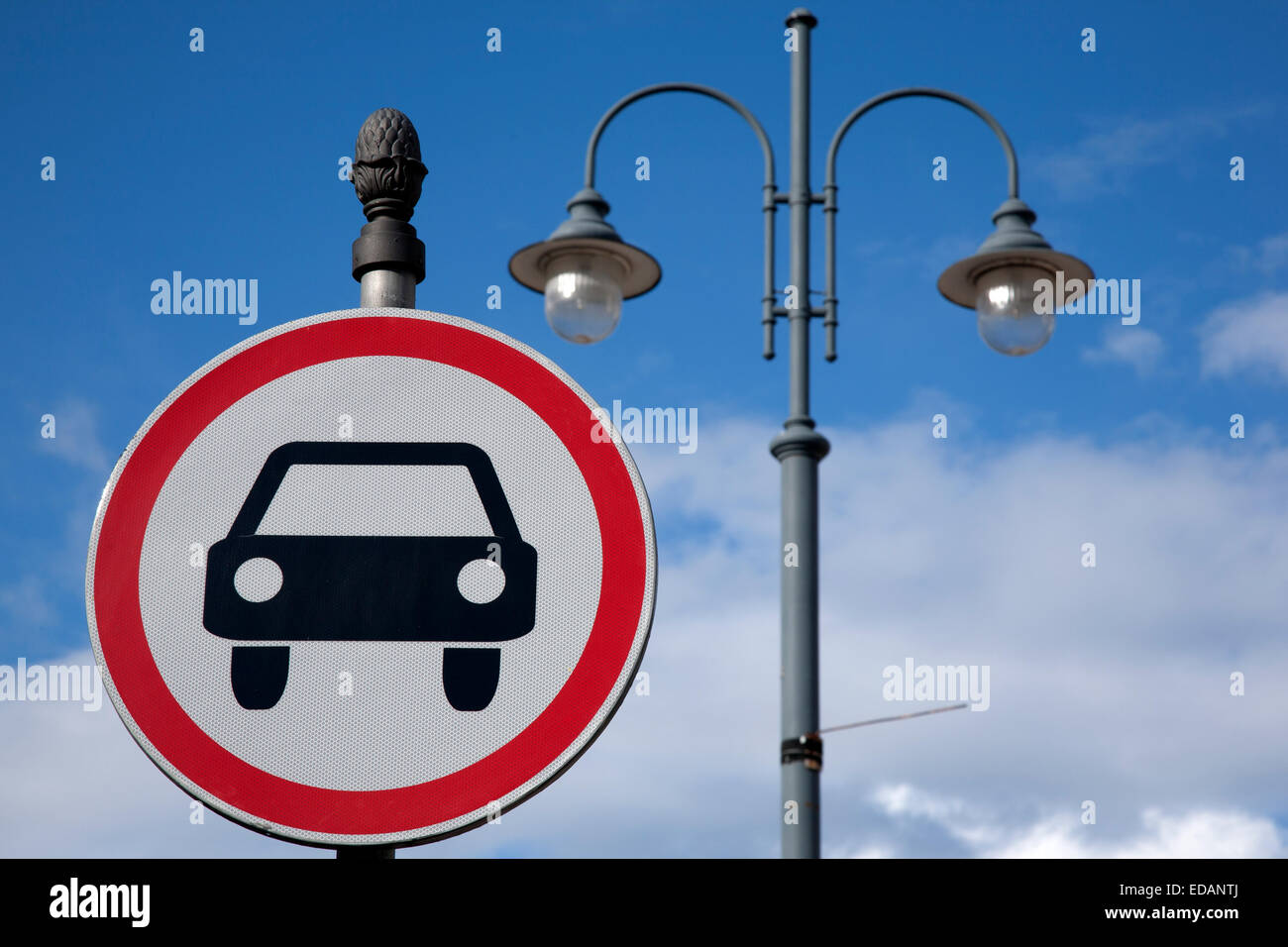 Car Sign and Lamppost against Blue Sky Background Stock Photo - Alamy